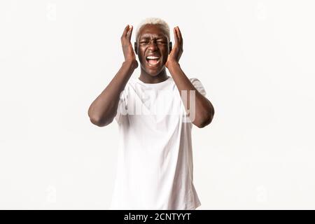 Portrait of distressed african-american panicking man, gasping and ...