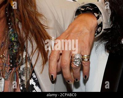 Aerosmith singer Steven Tyler poses with girlfriend Erin Brady and the ...