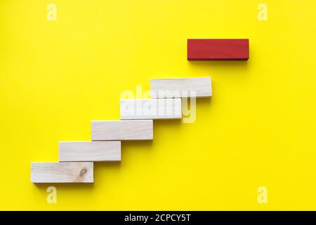 hand holding wooden cube block with 2022 text on blue background ...