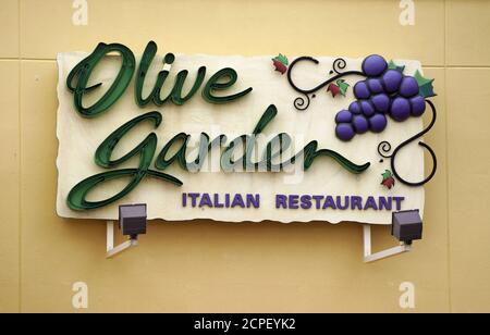 A logo sign outside of an Olive Garden restaurant location in Easton ...