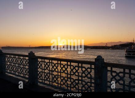 Sunrise in Istanbul at the Galata Bridge, Turkey with the Camlica Tower ...