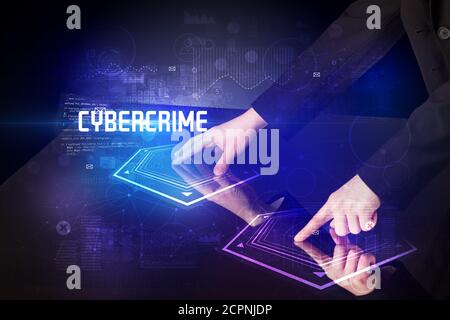 Hand touching digital table with CYBERCRIME inscription, new age ...