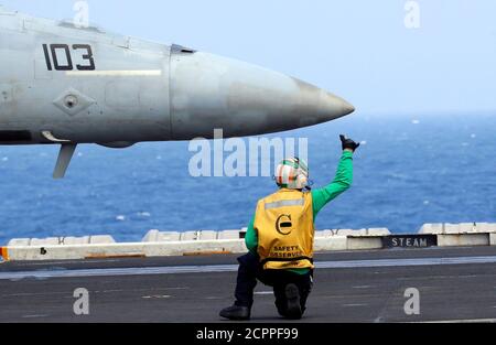 A F18 jet on the flight deck of the USS Gerald R. Ford, the 'world's ...