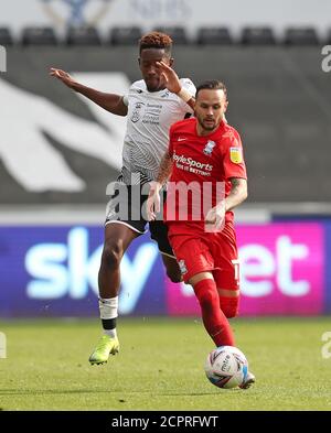 Swansea City's Jamal Lowe (left) and Stoke City's Ki-Jana Hoever battle ...