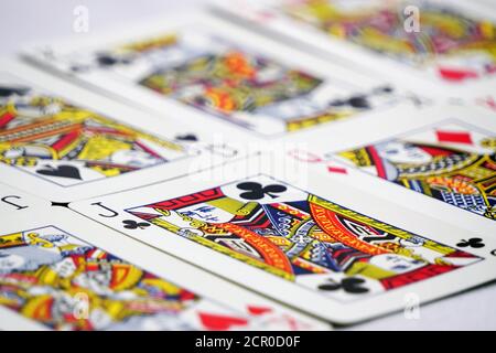 Assorted play cards and combinations on isolated white background close ...