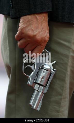 Starting pistol at an athletics event Stock Photo - Alamy