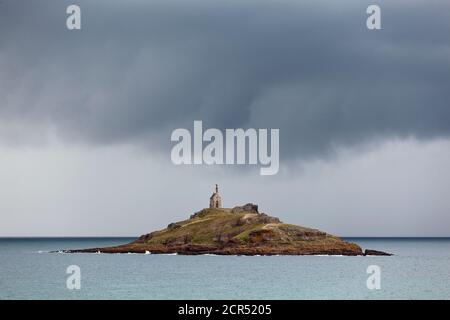 The tidal island of Ilot St. Michel at high tide with a view of Cap ...
