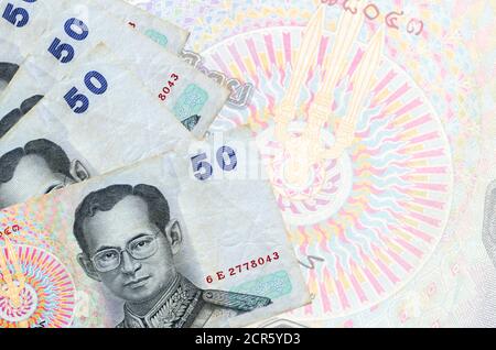 50 Thai Baht bills lies on bottom side of screen isolated on white ...