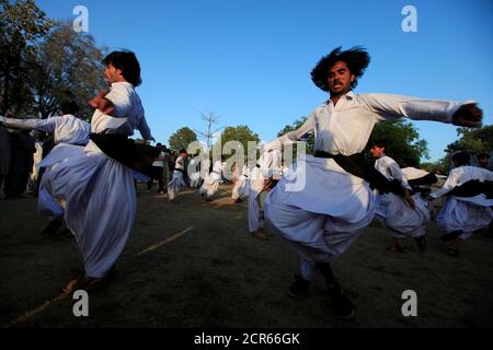 Pakistani tribal people perform a Pashtun's traditional "Mehsud" dance ...