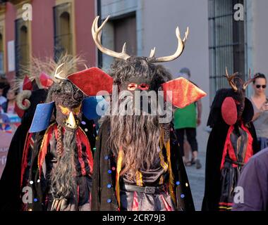 Mexican Devil creature with antlers walking and dancing in a parade in ...