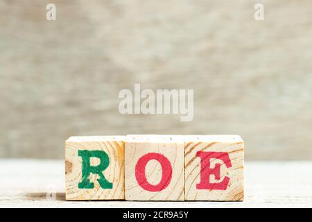 Alphabet letter in word ROE (Abbbreviation of Return on equity) on wood ...