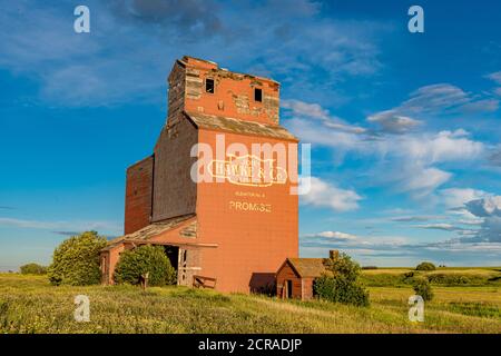 Brooking, SK- July 18, 2020: Sunset over the abandoned grain elevator ...