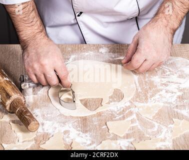 male cook preparing Christmas cookies, hands close-up Stock Photo - Alamy