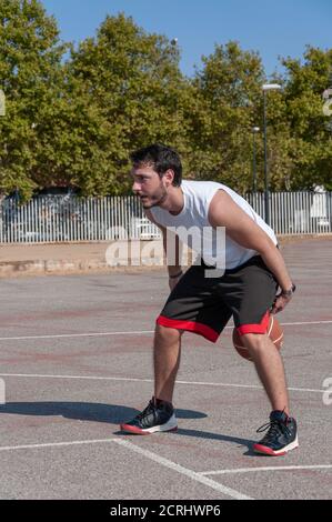 Closeup of an attractive in good shape guy playing basketball Stock ...