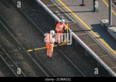 Railway workers using a loading gauge profile measuring device Stock ...