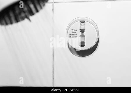 Save water four minute shower timer and shower head with water flowing ...