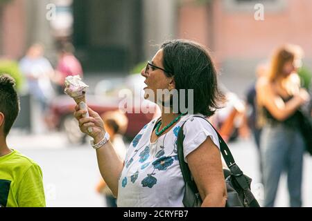 VITERBO ITALY. 20 September 2020. A woman enjoys eating her ice cream ...