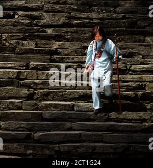 Henro pilgrim walking down steps, Kanonji temple, Kagawa, Shikoku ...