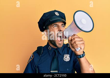 American police officer shouting through megaphone, yelling and ...