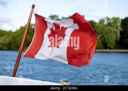 The Canadian flag is seen flying behind the National Archives building ...