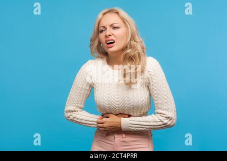 Woman suffering from appendicitis inflammation on white background ...