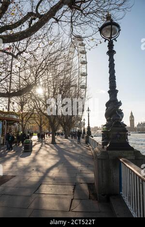 London cityscape with Dolphin lamp posts on the Queens Walk promenade ...