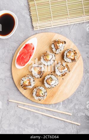 A top view of sushi rolls stuffed with Chuka wakame served in a white ...