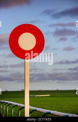 Circular Winning Post sign with blue sky behind Stock Photo - Alamy