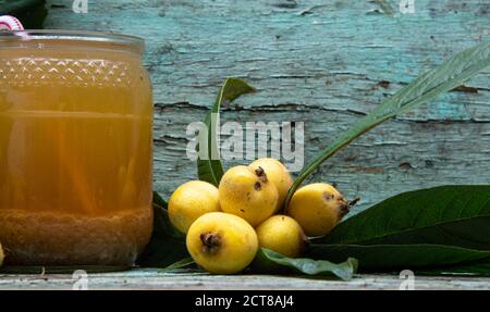 Yellow medlar fruit juice (Eriobotrya japonica). Plant of the botanical ...