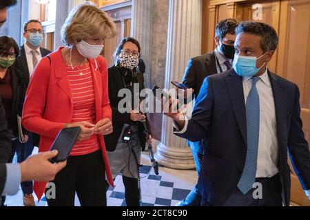 U.S. Sen. Lisa Murkowski (R-AK) talks to reporters as she heads to the ...