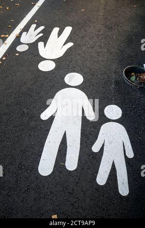 white pedestrian pathway marking on tarmac Stock Photo - Alamy
