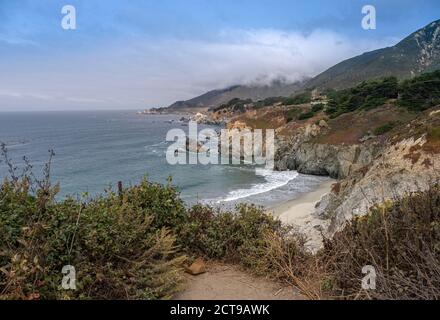 Coast with rocks, plants, trees and waves of Atlantic Ocean. Shore on a ...