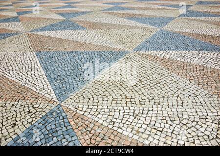 Mosaic tiles pavement background. Triangle paving. Aged photo. Black ...
