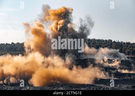 Explosive works on open pit coal mine industry Stock Photo - Alamy