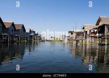 Myanmar, View of fishing village and wooden path at Lake Inle Stock ...