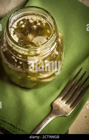 sliced jalapeno pepper in wooden spoon isolated on white background ...