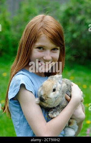Girl holding a dwarf rabbit, Upper Bavaria, Bavaria, Germany Stock ...