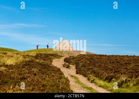 Walkers approaching the commemorative summit cairn at Dunkery Beacon (1 ...
