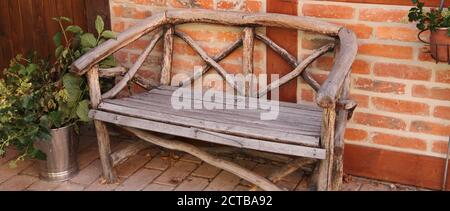 Red brick house front with red bench and red front-door .Edam, the ...