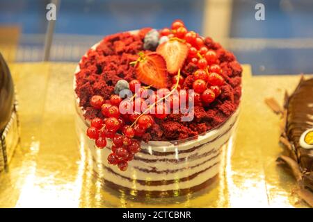 One Big Mix Red Berry Cake in Patisserie Stock Photo - Alamy