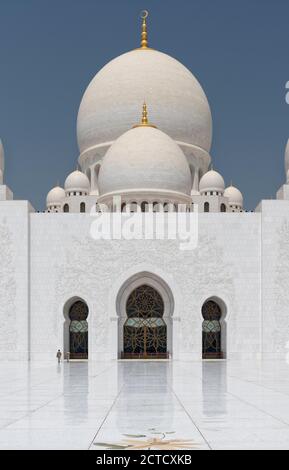 Vertical shot of the domes of Sheikh Zayed Grand Mosque in Abu Dhabi as ...
