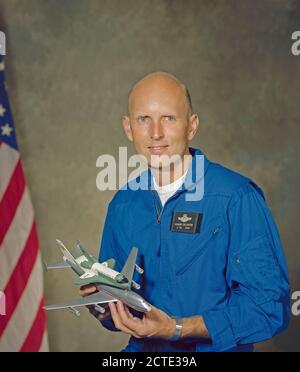 (8 Sept 1976) --- Astronaut C. Gordon Fullerton in flight suit holding ...