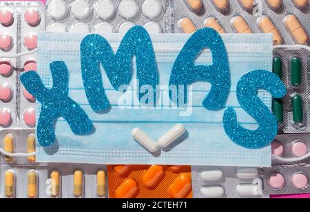 Medical Christmas background. Pills, blister and santa claus hat,on a ...