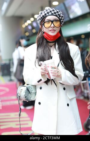 Chinese singer and actress Dai Yanni appears at the airport in Beijing ...