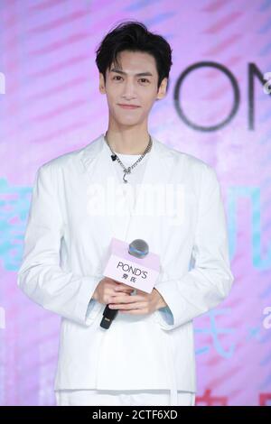 Chinese actor Luo Yunxi, also known as Leo Luo, attends an exhibition ...