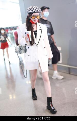 Chinese singer and actress Dai Yanni appears at the airport in Beijing ...