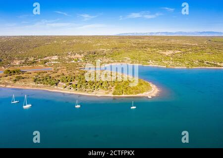 Aerial drone view of a beautiful coast town with sandy beaches and ...