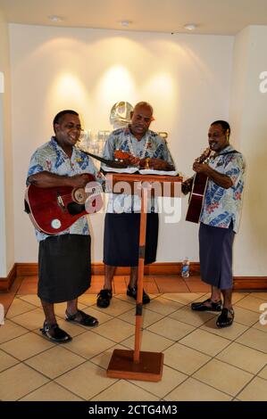 A trio of Fijian musicians, performing as a welcome to hotel guests in ...