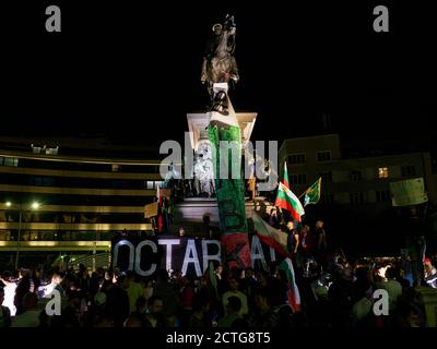Monument to the Tsar Liberator covered with flags during a protest ...