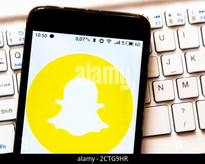 In this photo illustration, a Snapchat logo seen displayed on a ...